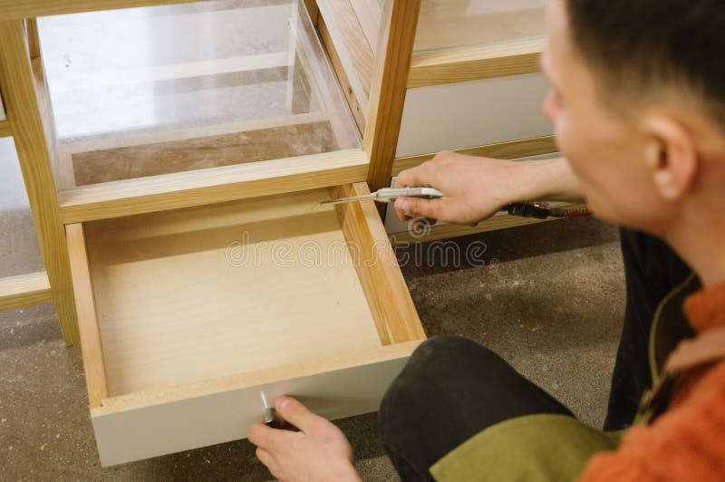 Man Opens a Drawer in the Table Stock Photo - Image of blank, carpentry ...