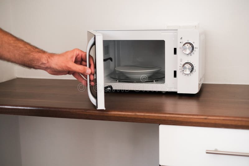 Man Opens Microwave To Get His Plate of Food Stock Image - Image of ...