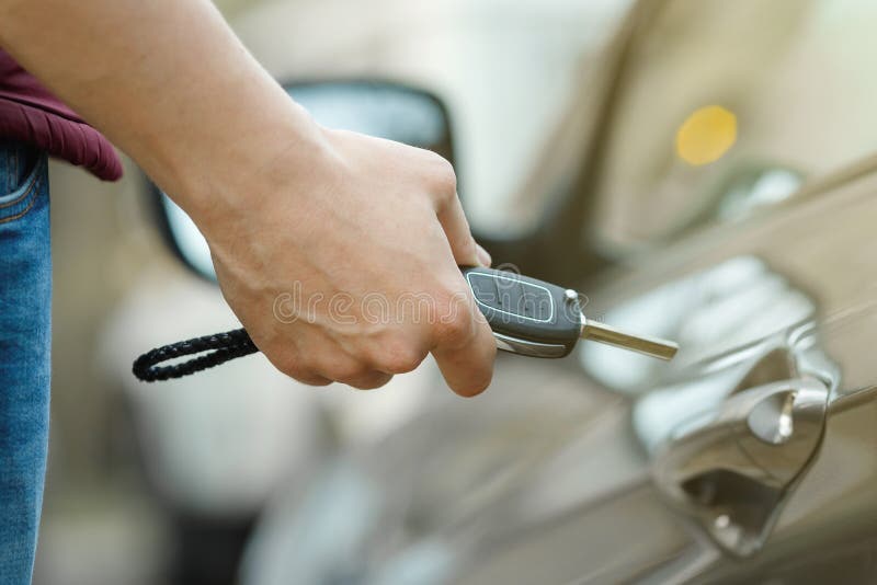 A Man Opens a Rent Car Sharing Door with a Key, Close-up Hand Stock ...