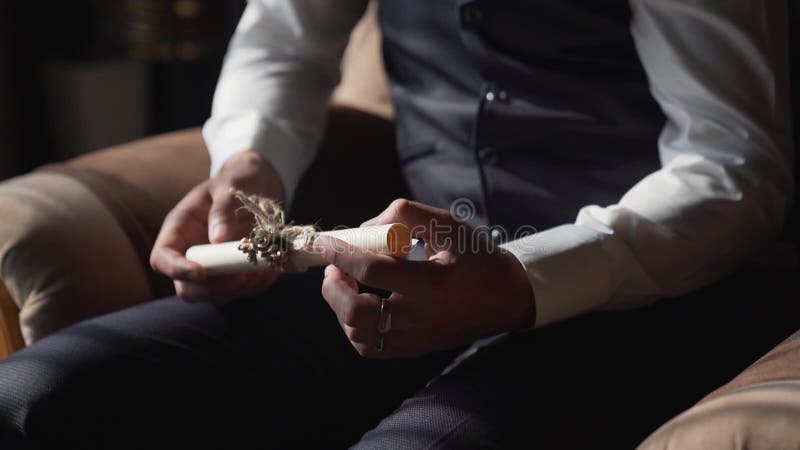 The Man Opens the Scroll. the Hand of Men Unfolds the Old Antique ...