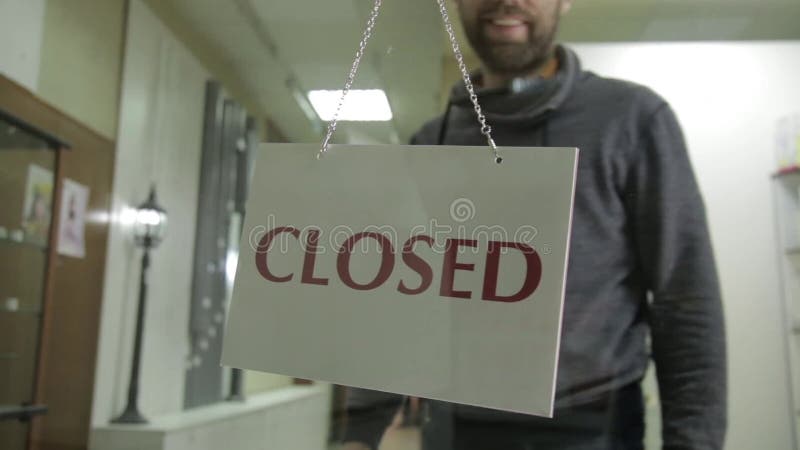 Man Opens Store and Flipping Nameplate with Closed Sign Stock Footage ...