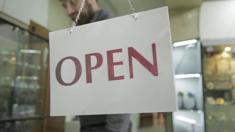 Man Opens Store and Flipping Nameplate with Closed Sign Stock Video ...