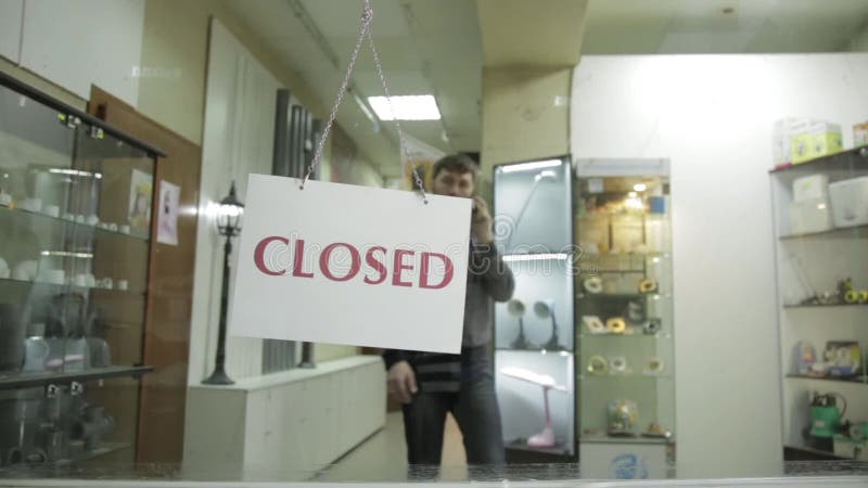 Man Opens Store and Flipping Nameplate with Closed Sign Stock Video ...
