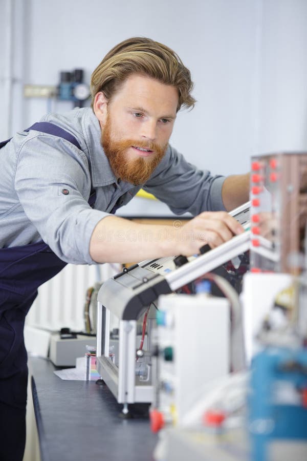 Man Operates Automatic Packing Machine Stock Image - Image of ...