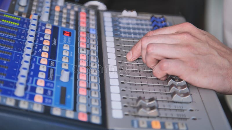 A Man Operates a Mixing Console. Stock Photo - Image of monitor, mixing ...