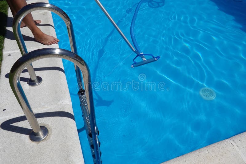 Man Operates Pool Cleaner Next To a Private Pool Ladder Stock Photo ...