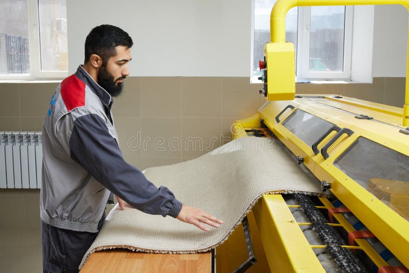 Man Operating Carpet Automatic Washing Machine in Professional Laundry ...