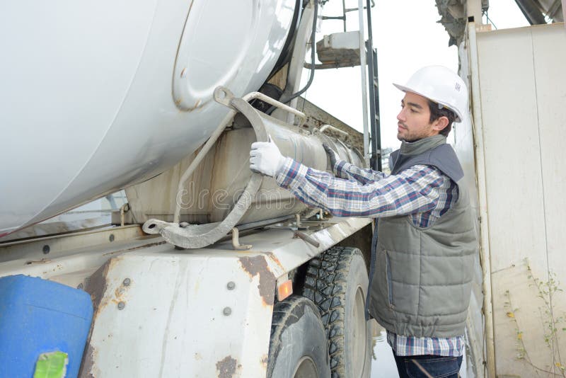 Man operating cement lorry stock image. Image of transport - 314279821