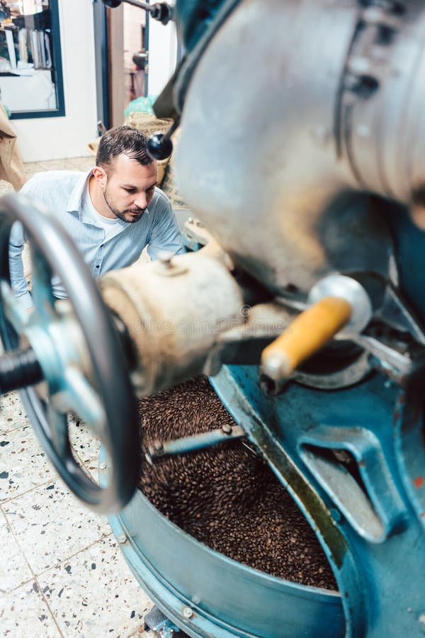 Man Operating Coffee Roaster Stock Photo - Image of coffeehouse ...