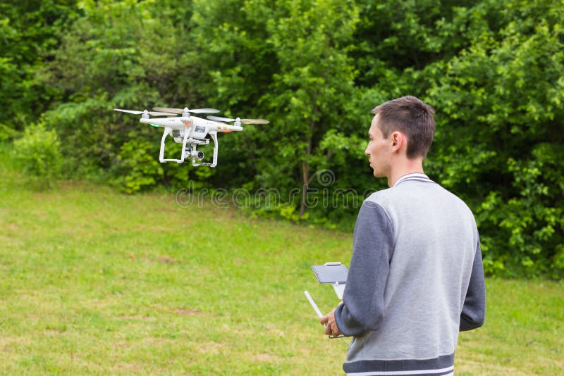 Ufa, Russia. - 6 June 2016 : Man Operating Drone Flying or Hovering by ...