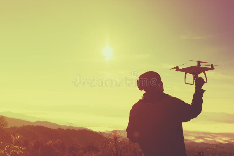 Man operating a drone. stock image. Image of quadrocopter - 104978365