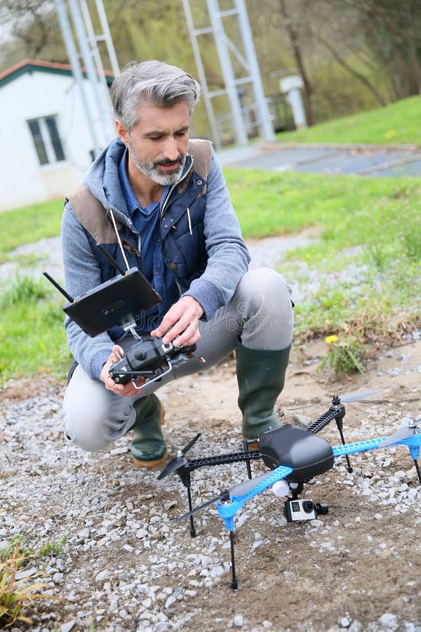 Man Operating a Drone with Remote Control Outdoors Stock Photo - Image ...