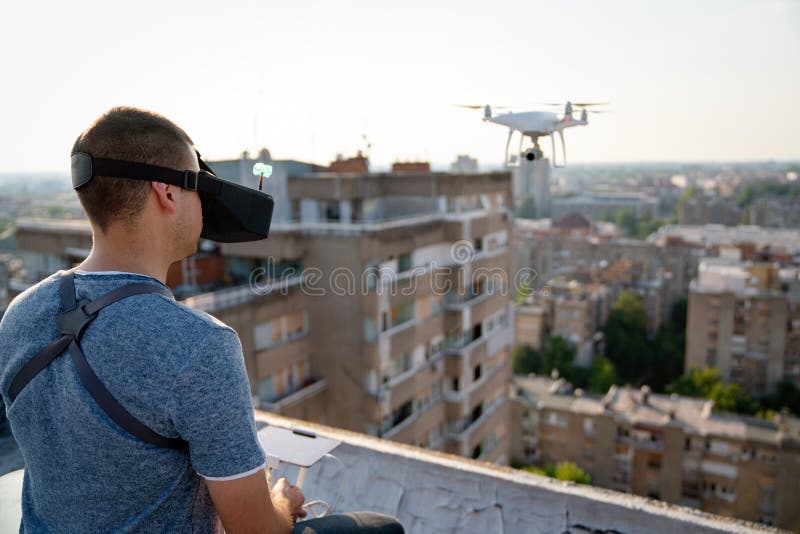 Man Operating a Drone with Remote Control on Rooftop Stock Image ...