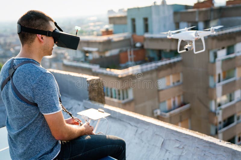 Man Operating a Drone with Remote Control on Rooftop Stock Image ...