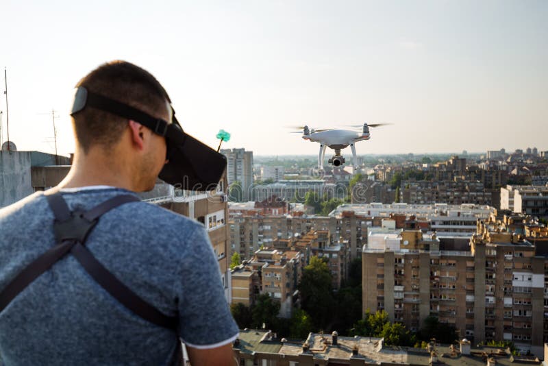 Man Operating a Drone with Remote Control on Rooftop Stock Image ...