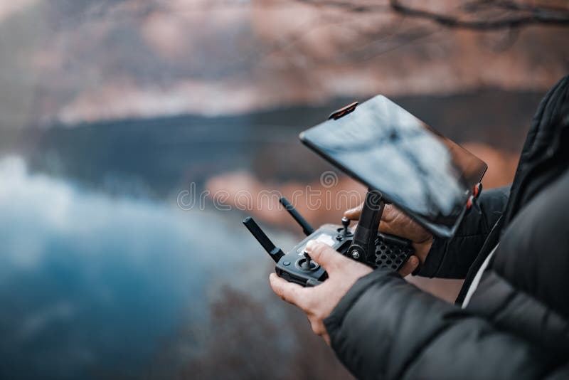 Man Operating a Drone Using a Remote Controller. Stock Photo - Image of ...
