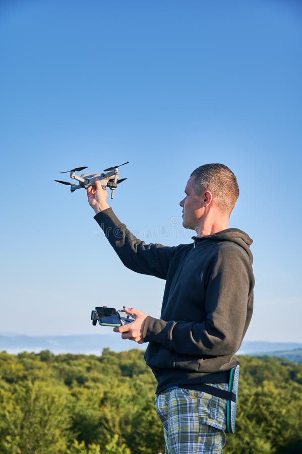 Man Operating Drone Using Remote Controller. Stock Photo - Image of ...