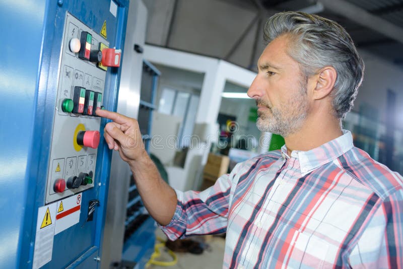 Man Operating Factory Machine Stock Image - Image of cabinet, energy ...
