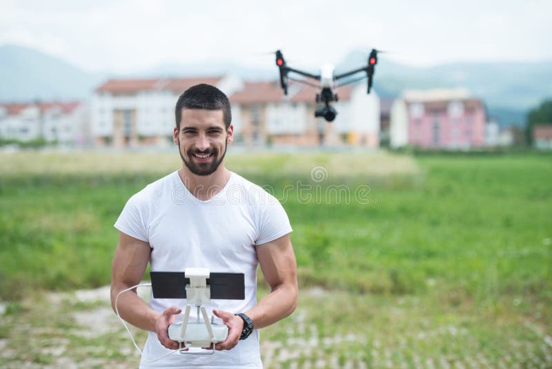 Man Operating a Flying Drone in the Sky Stock Photo - Image of person ...