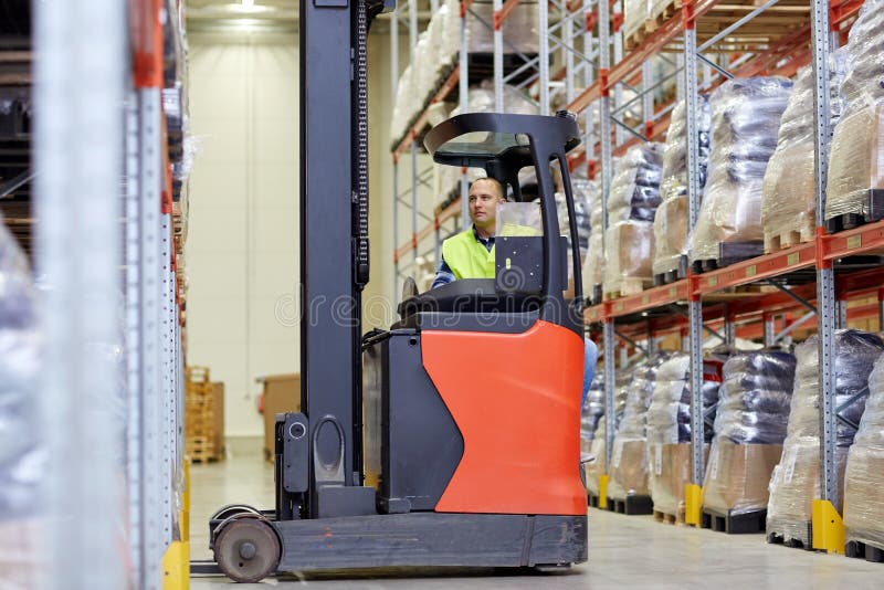Man Operating Forklift Loader at Warehouse Stock Photo - Image of ...