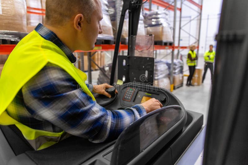 Man Operating Forklift Loader at Warehouse Stock Photo - Image of ...