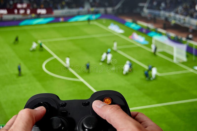 Man Operating a Game Controller in Front of a Screen Stock Image ...