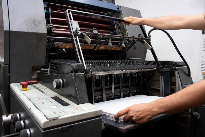 Man Operating Industrial Printer High Performance Printing Process ...