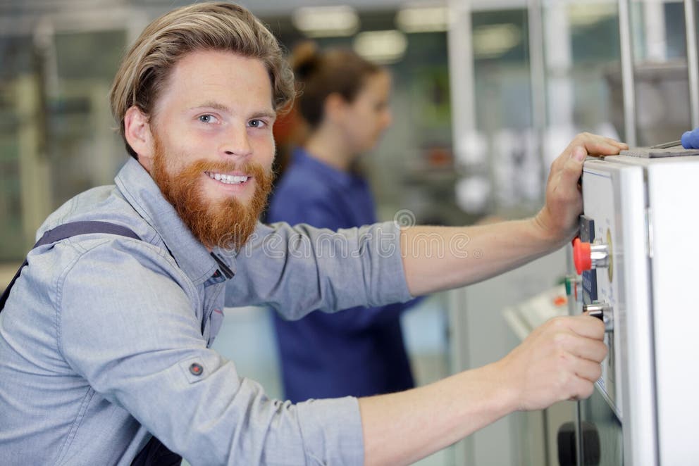 Man operating machine stock image. Image of industrial - 205265603