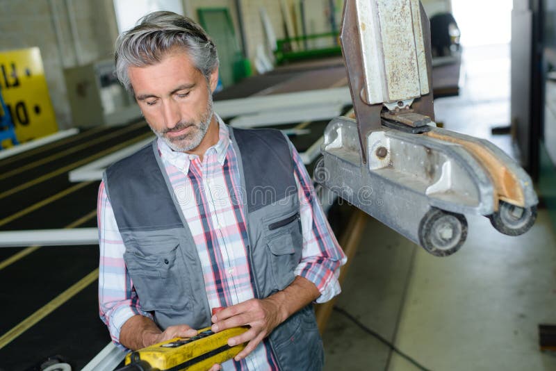 Man operating machine stock image. Image of wireless - 332668733