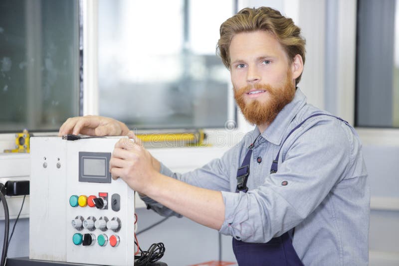 Man Operating Machine High Lift with Hand in Industrial Area Stock ...
