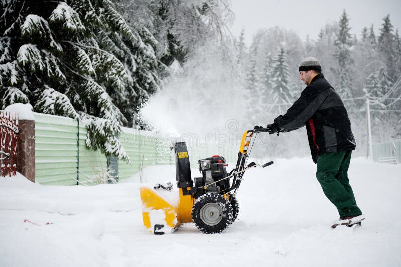 A Man Operating Snow Blower Stock Photo - Image of machine, person ...