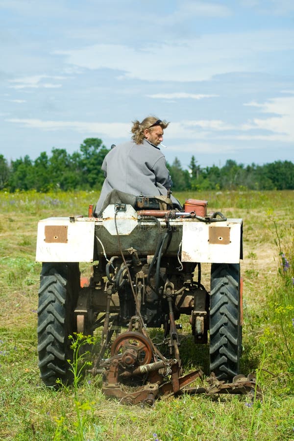 Man operating a tractor stock image. Image of farmer, wheels - 2742781