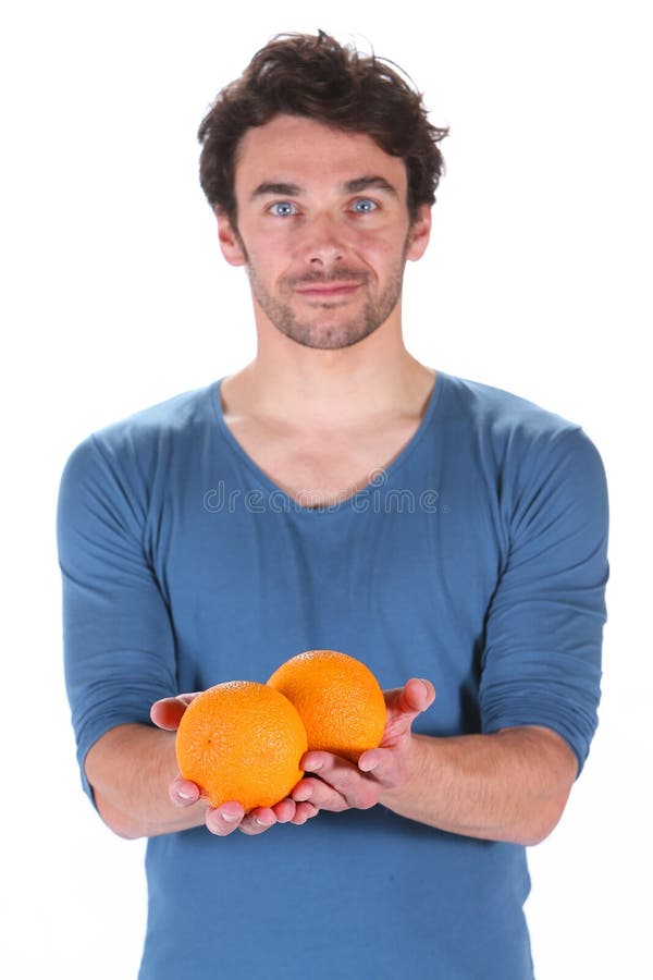 Man holding an orange stock image. Image of indoor, healthy - 22198051