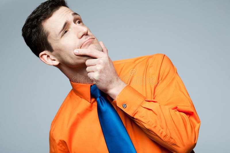 Man in Orange Shirt Thinking about Problem. Stock Photo - Image of ...