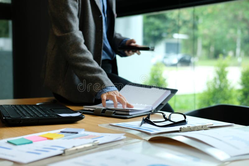 Man Organizing Plan with Notebook & Smart Phone. Businessman Working at ...