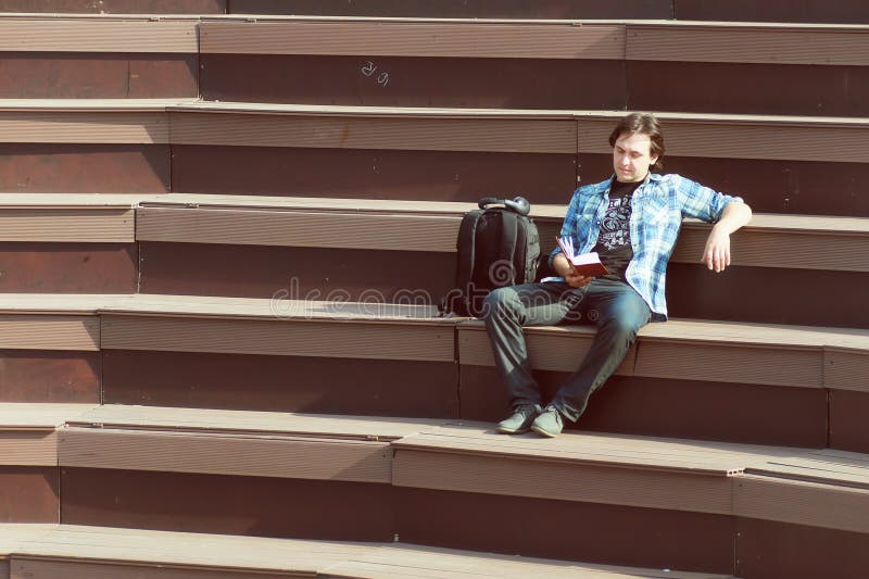 Man Outdoor Alone Sit on Step Stock Photo - Image of male, city: 107708594