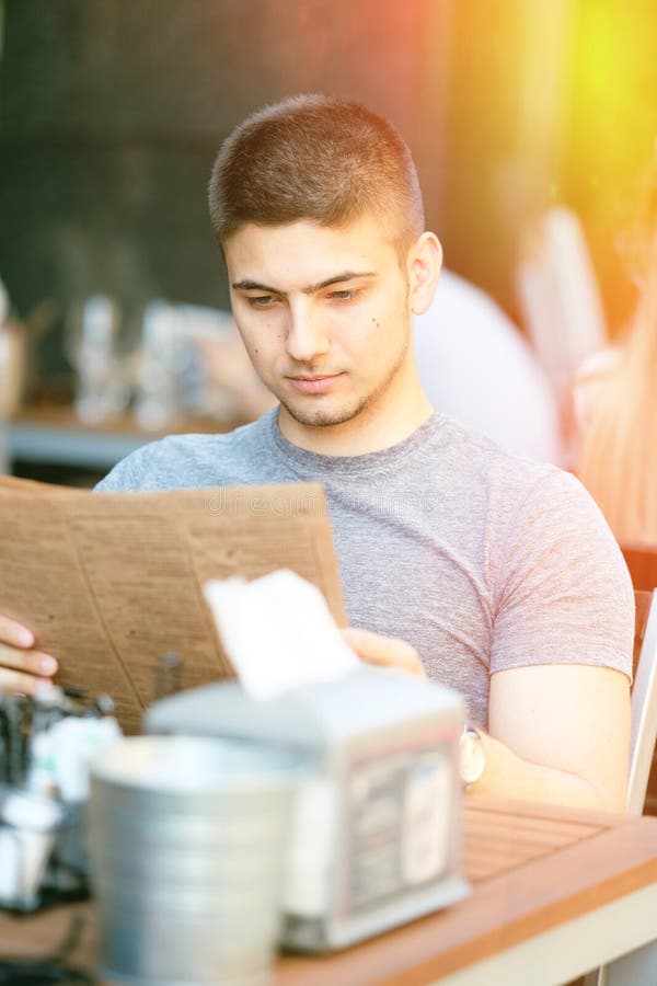 Man in Outdoor Restaurant Looking at the Menu Stock Photo - Image of ...