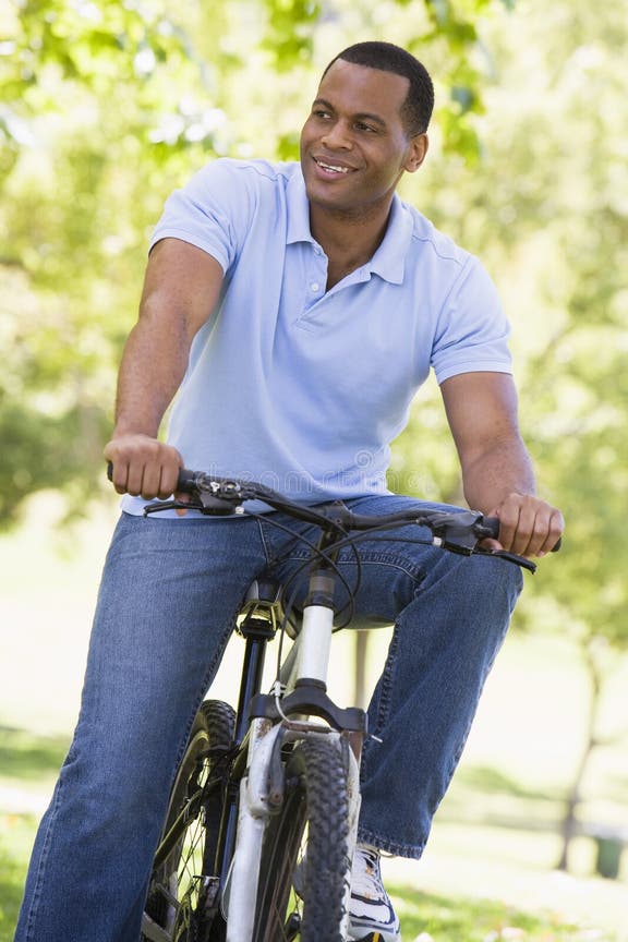 Man Outdoors on Bike Smiling Stock Image - Image of camera, person: 5934795