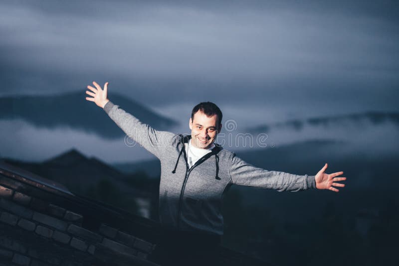 Man Outdoors on the Roof of the Building Stock Image - Image of ...
