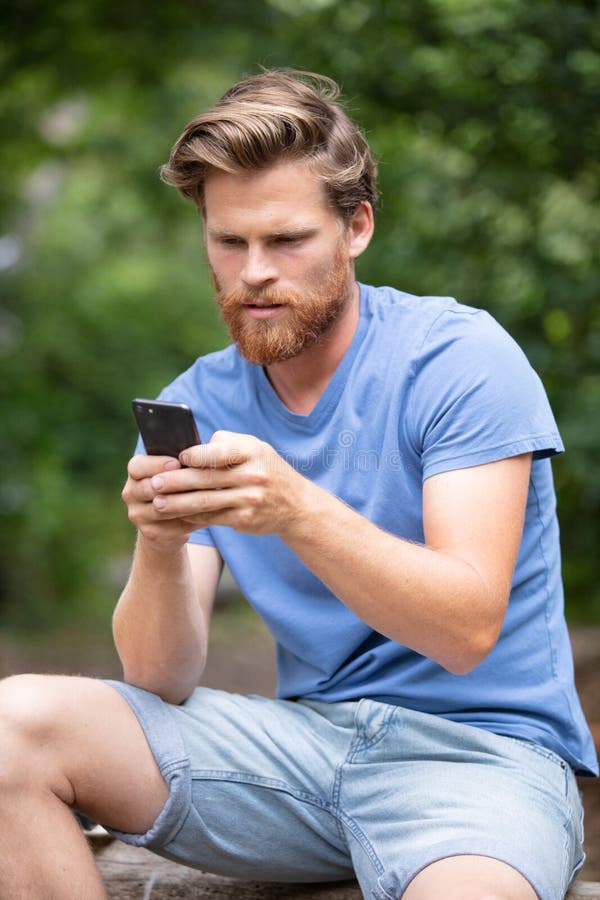 Man Outdoors Sending Message on Smartphone Stock Photo - Image of ...