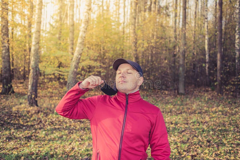 Man Outdoors Takes Off the Mask from Coronavirus. Man in Outdoors Takes ...