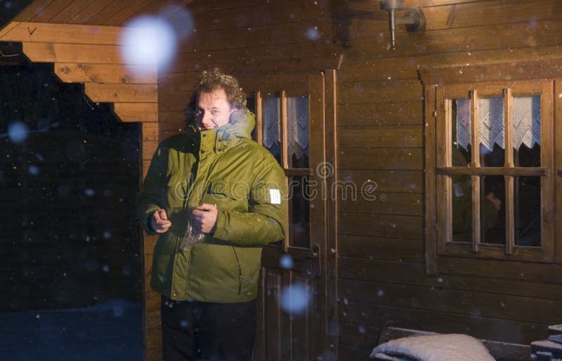 Man outside house in snow stock photo. Image of coast - 18411074