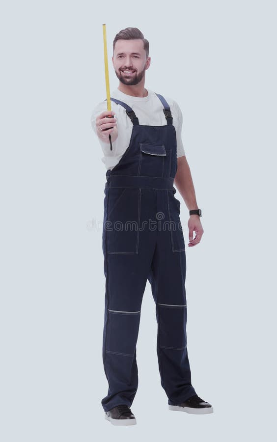 Man in Overalls with a Construction Tape Measure. on White Stock Image ...