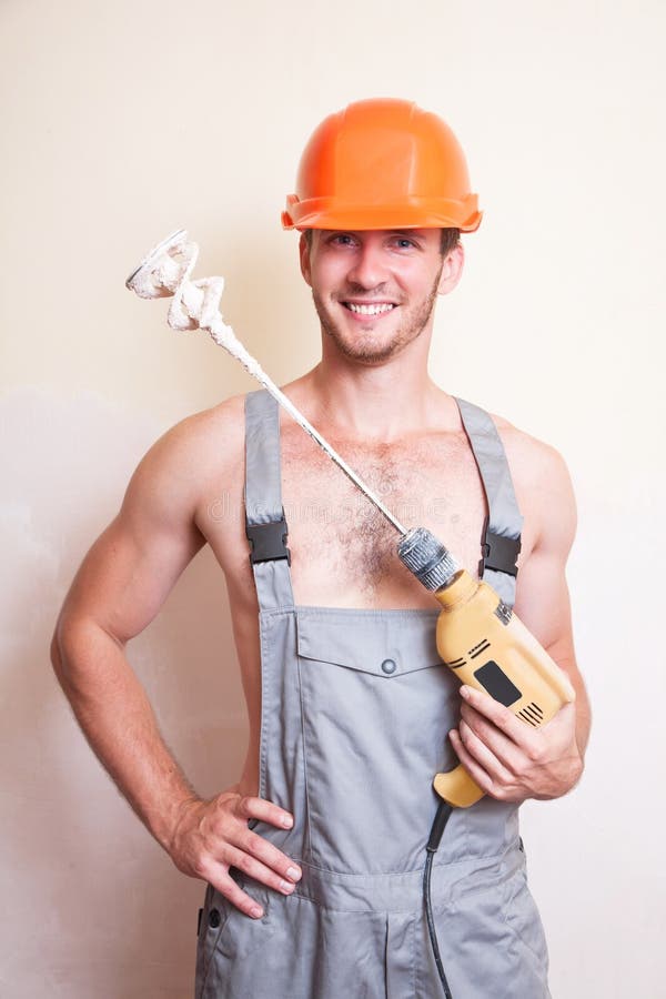 Man in Overalls with a Mixer for Plastering Stock Image - Image of ...