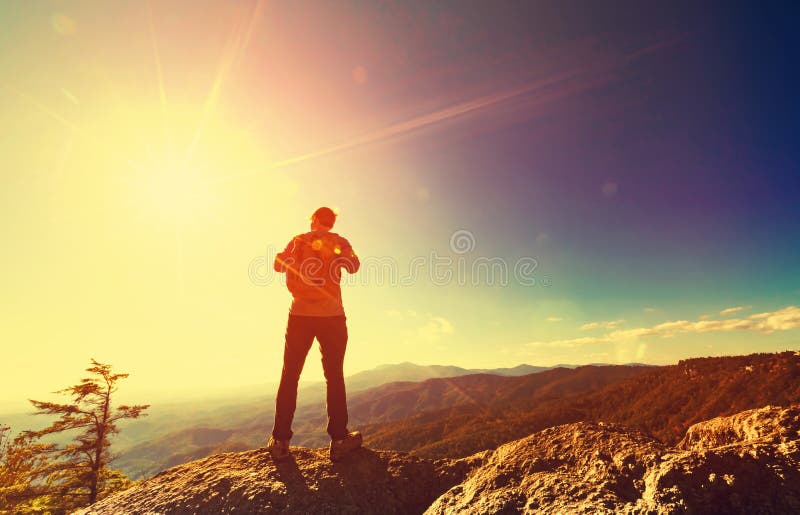 Man Overlooking the Mountains Belown Stock Photo - Image of filtered ...