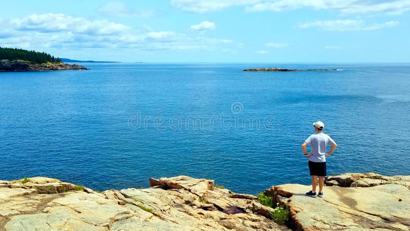Man Overlooking Ocean Cliffs in Acadia National Park - Maine Stock ...