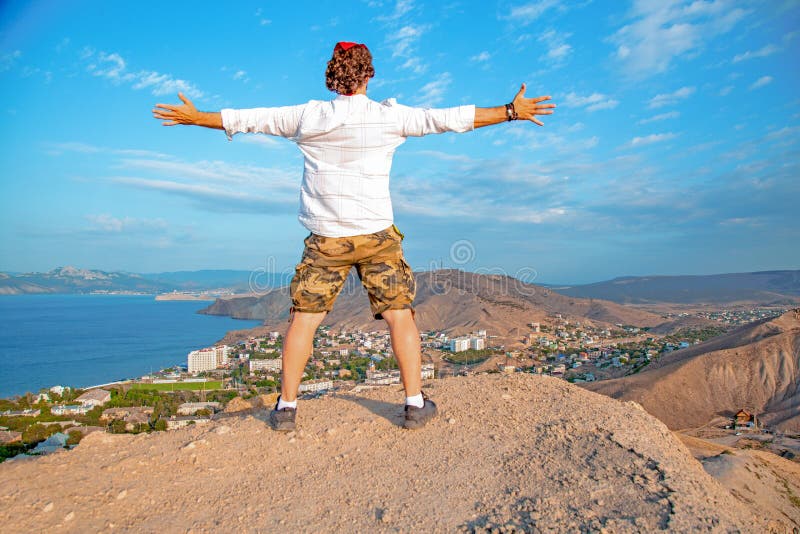 A Man Overlooking a Panoramic View of a Beautiful Coastline Stock Image ...