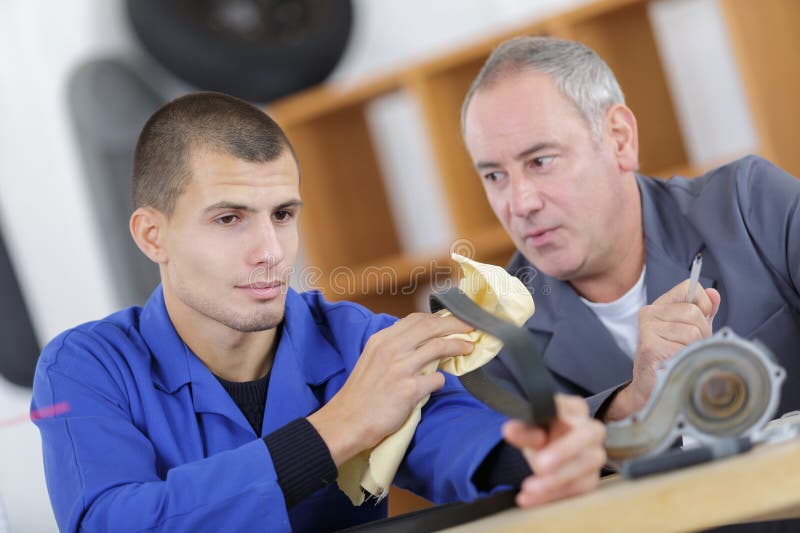 Man Overseeing Trainee Working Stock Image - Image of heating, hand ...