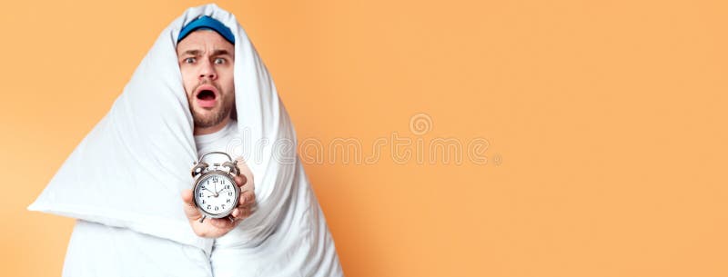 Emotional Guy in Blanket Holding an Alarm Clock Stock Image - Image of ...