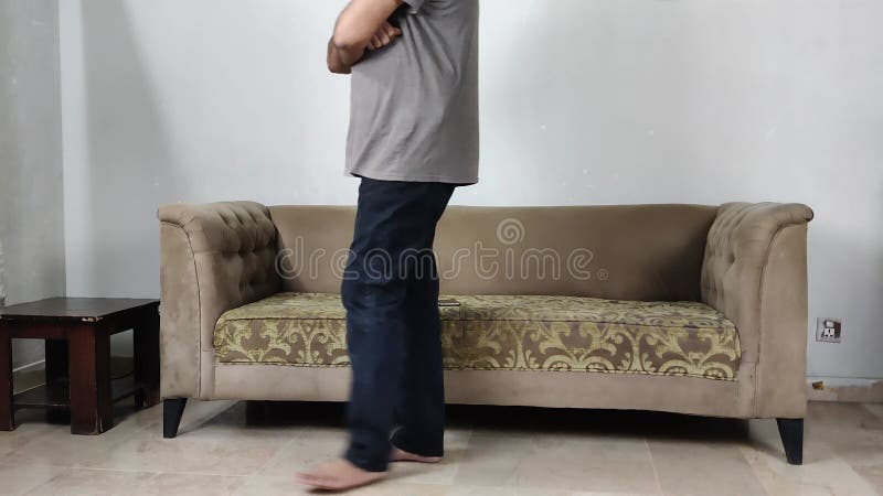 Body Language of Man Pacing with Folded Hands in Quiet Room Captured ...